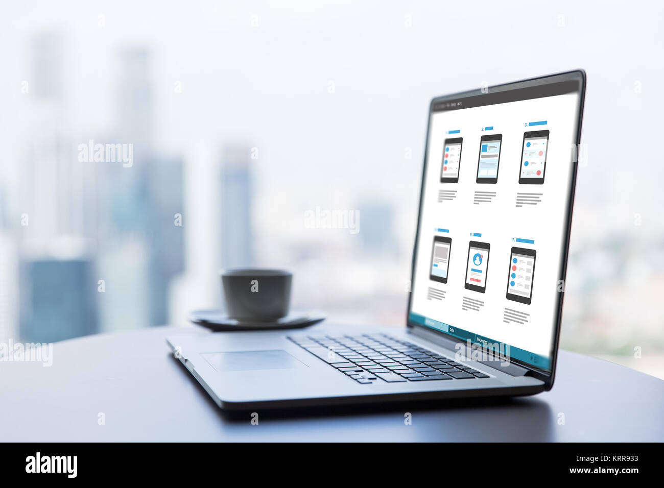 laptop with smartphone interface design on screen Stock Photo - Alamy