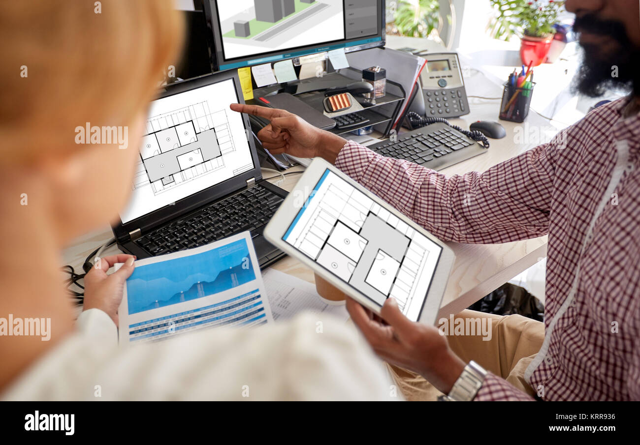 architectors with blueprints on computers Stock Photo - Alamy