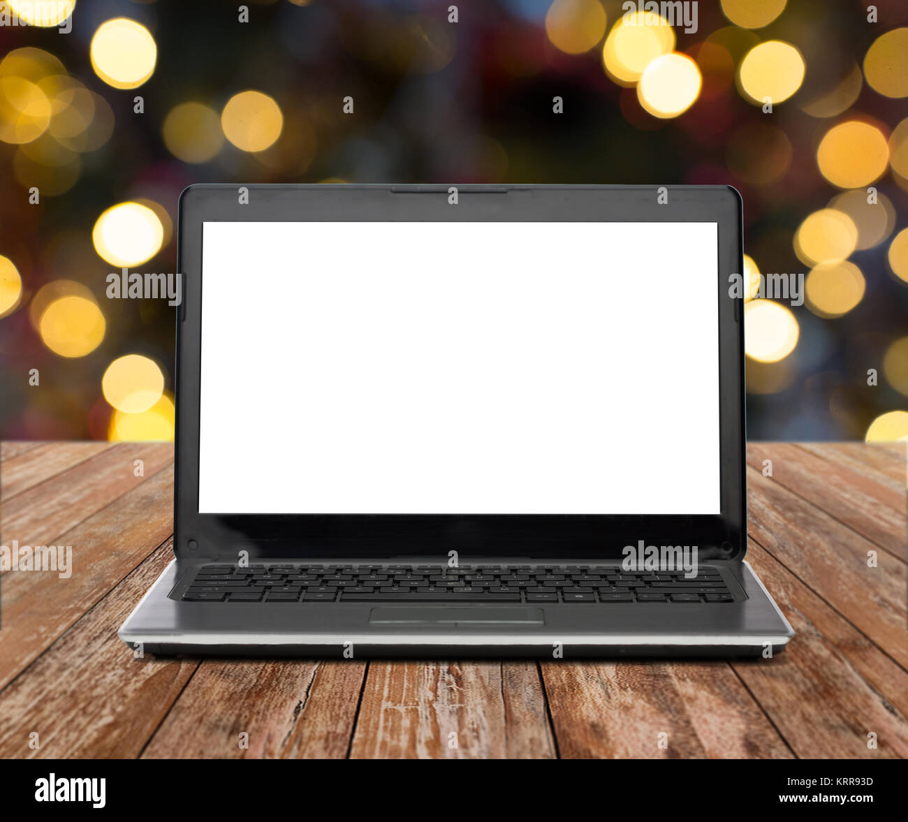 laptop with white screen over christmas lights Stock Photo - Alamy