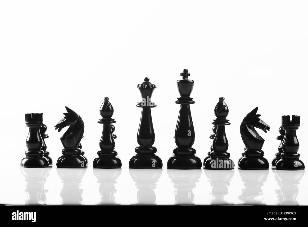 Chess black team over a white background Stock Photo - Alamy