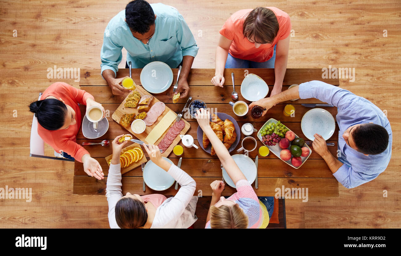 group of people having breakfast at table Stock Photo - Alamy