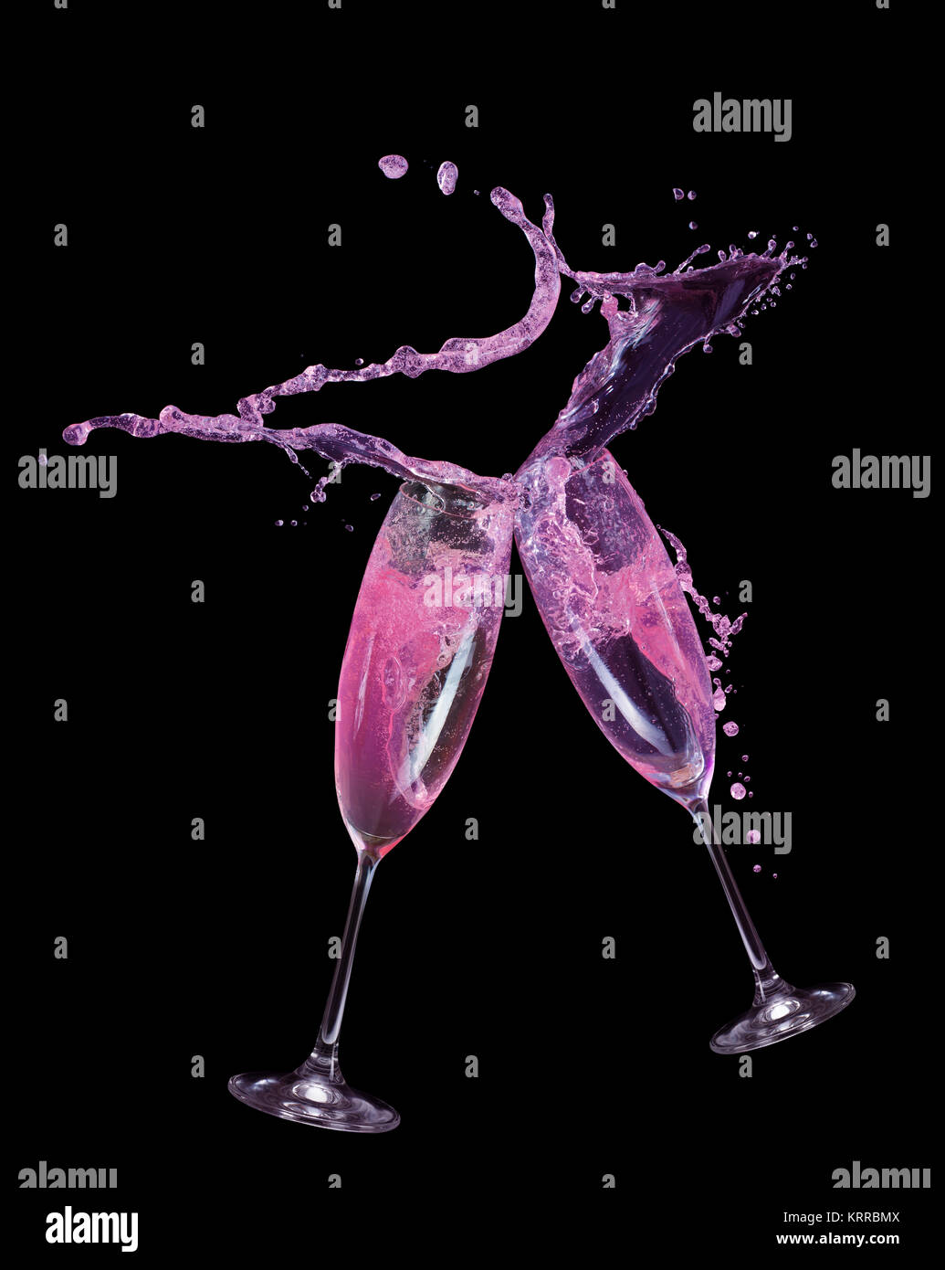 pink champagne splash in glass on a black background Stock Photo - Alamy