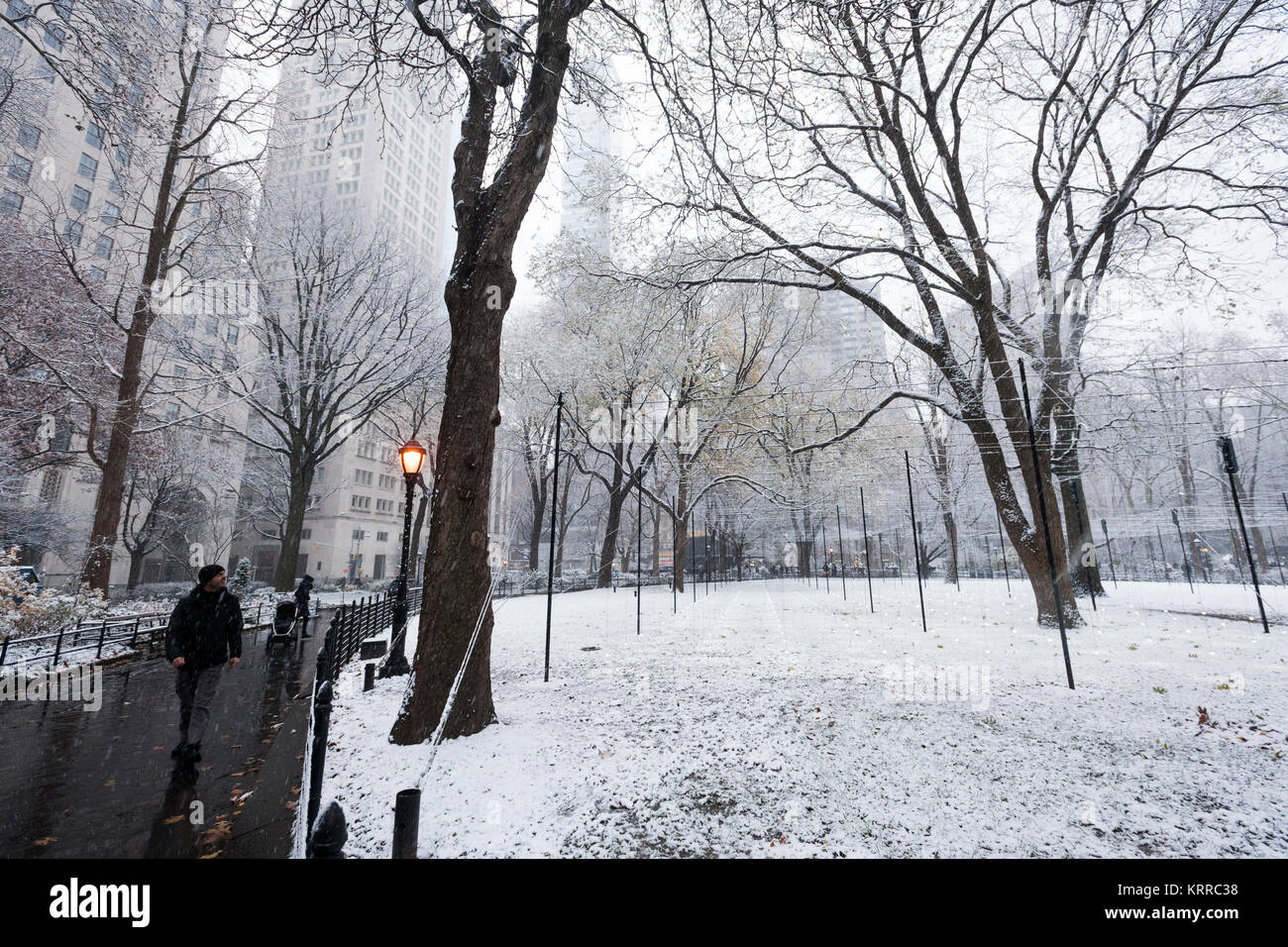 Visitors to Madison Square Park in New York enjoy the snow as they pass ...