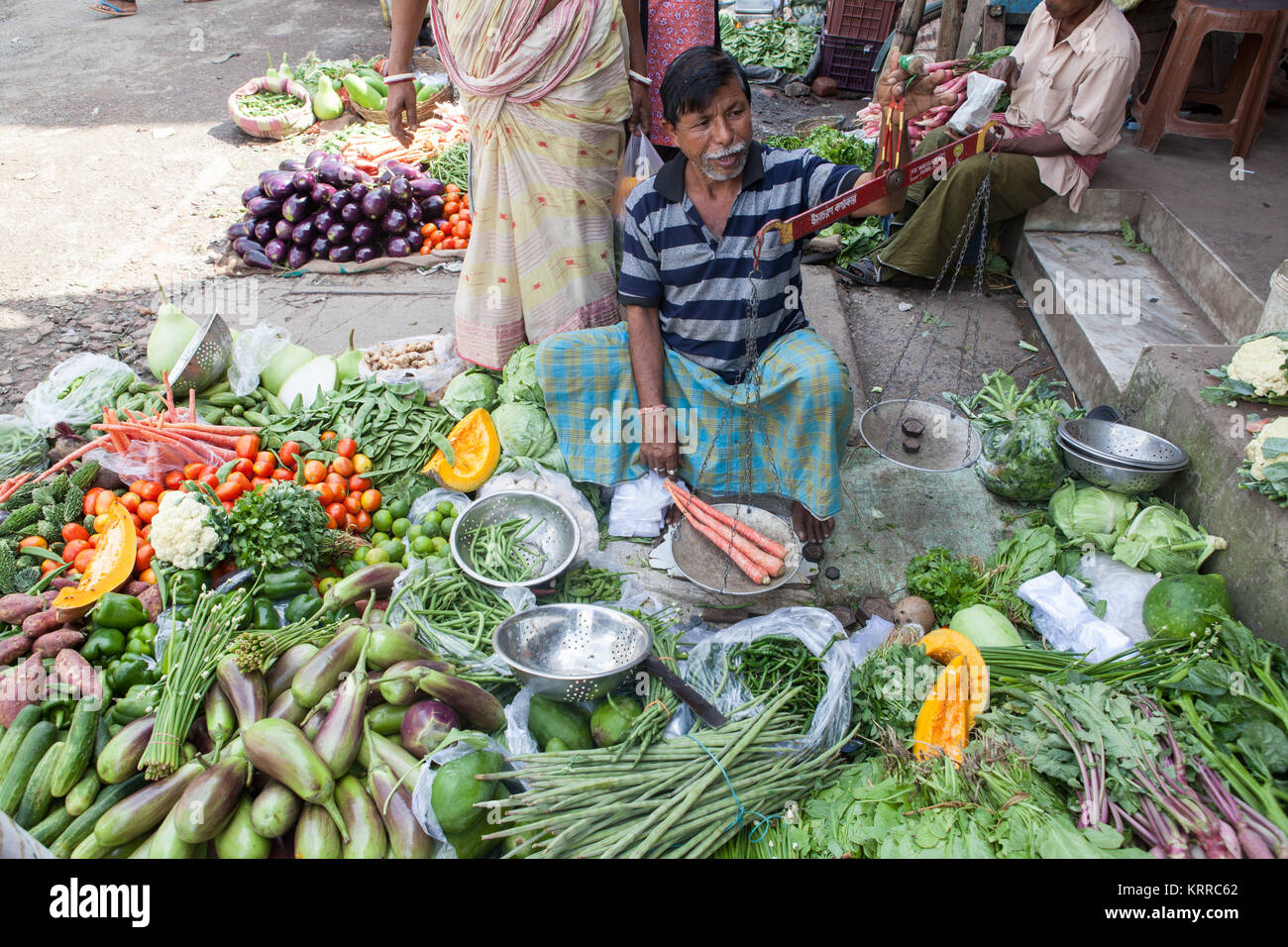 Vegetable vendor weighing vegetables selling hi-res stock photography and images - Alamy