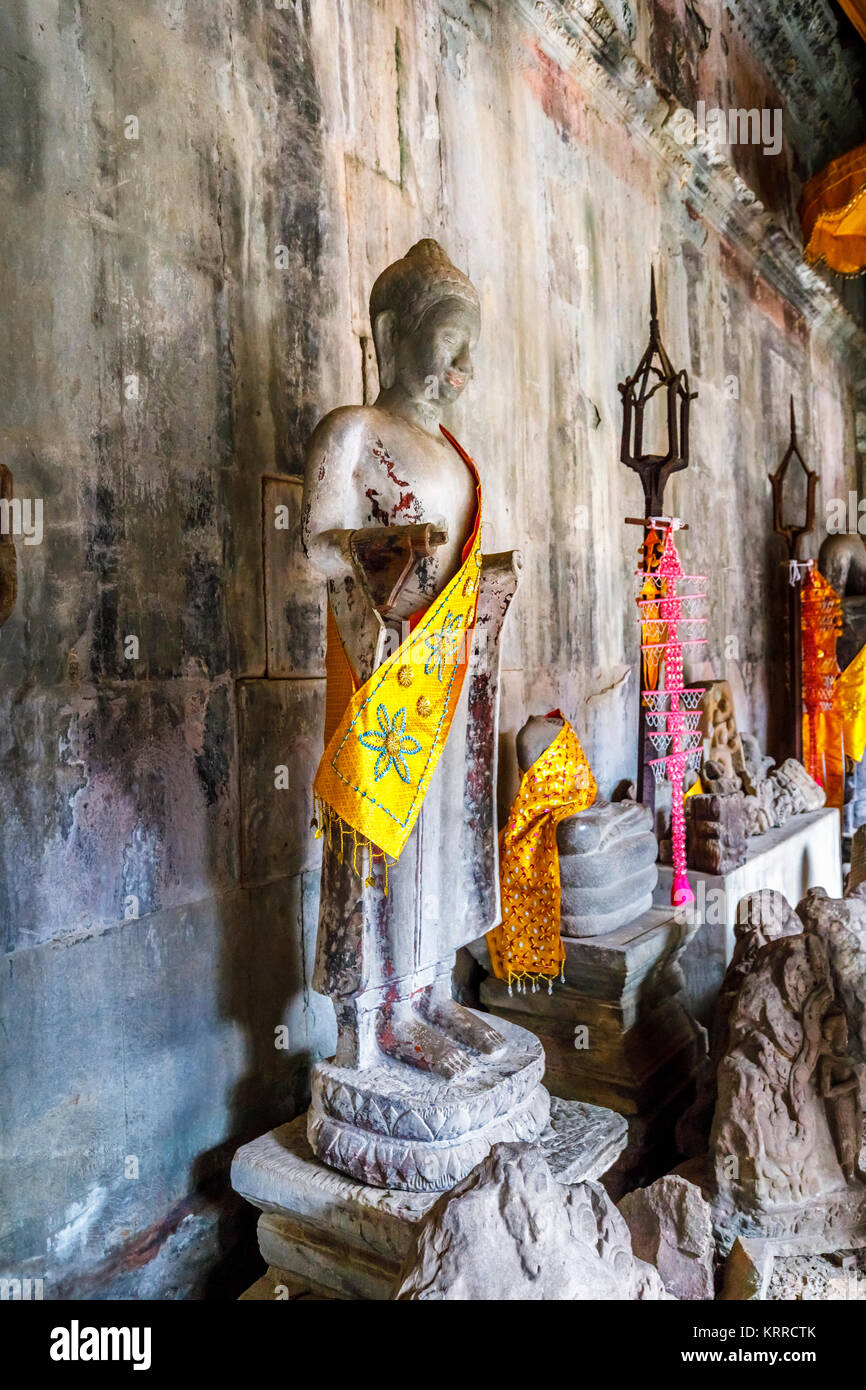 Damaged Buddha statue without hands in Angkor Wat, a temple complex ...