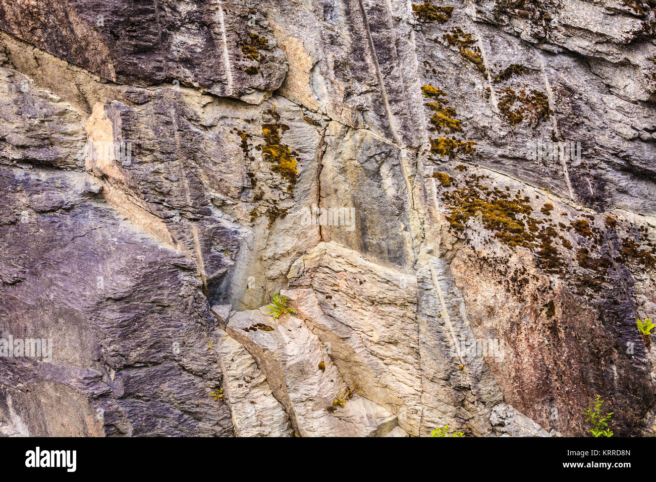 Background of natural wet stone wall texture, rough rock solid surface ...