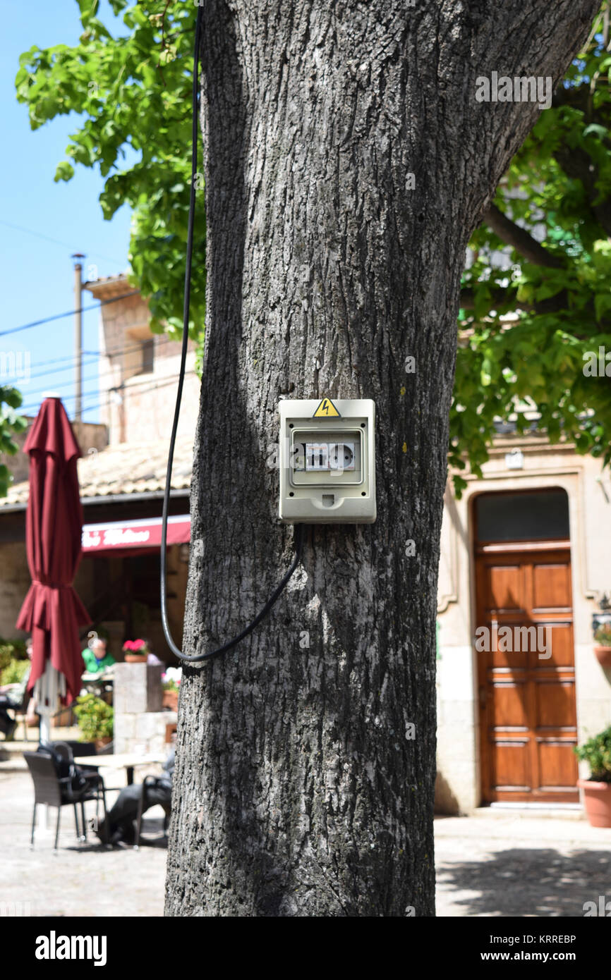 Streets of Valldemossa, Mallorca with a power socket on a tree Stock ...