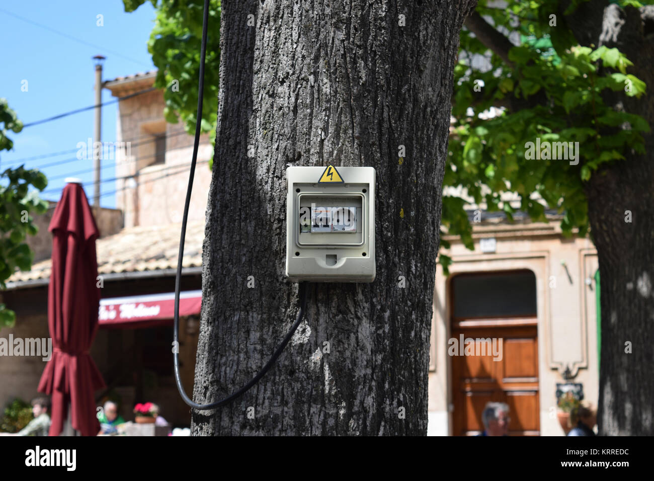 Streets of Valldemossa, Mallorca with a power socket on a tree Stock ...