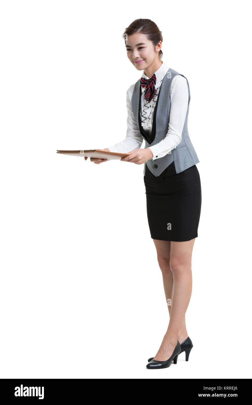 Smiling waitress in hotel holding menu Stock Photo - Alamy