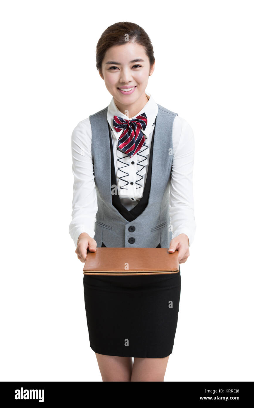 Smiling waitress in hotel holding menu Stock Photo - Alamy