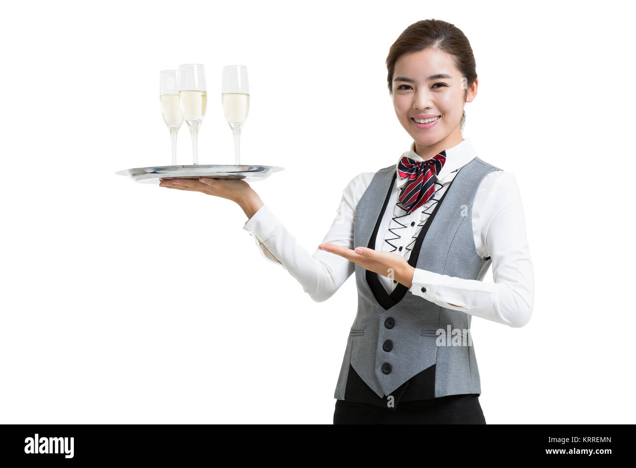 Smiling waitress in hotel serving champagne Stock Photo - Alamy