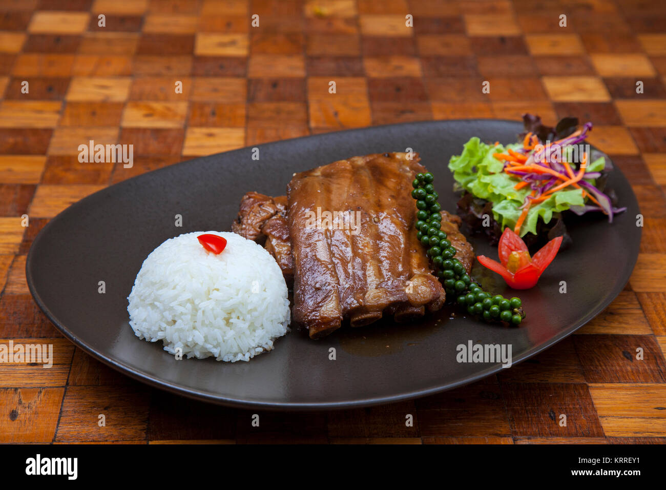 Roast pork ribs with honey, quick menu Stock Photo - Alamy