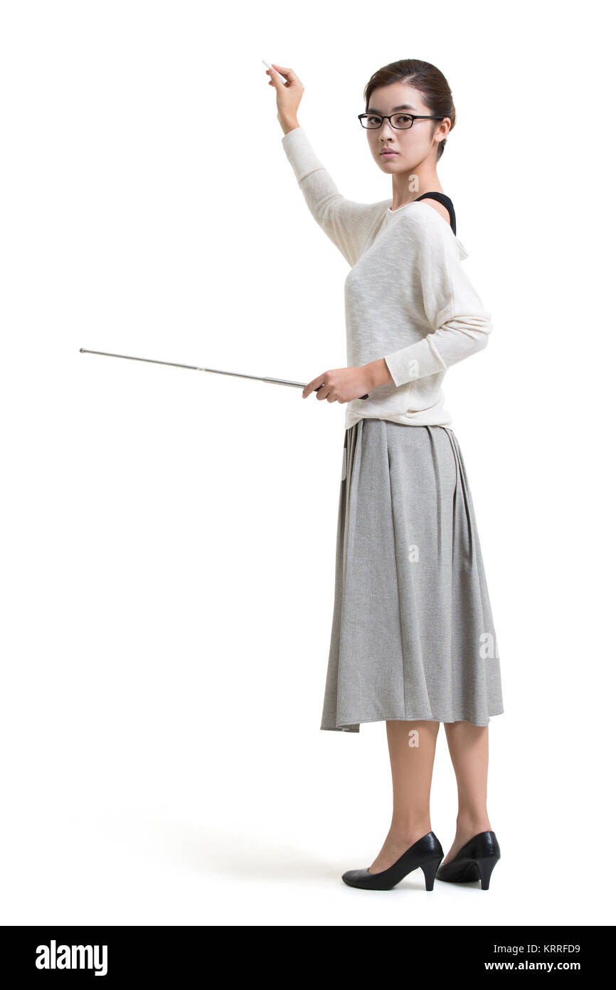 Young female teacher holding teacher's pointer Stock Photo - Alamy