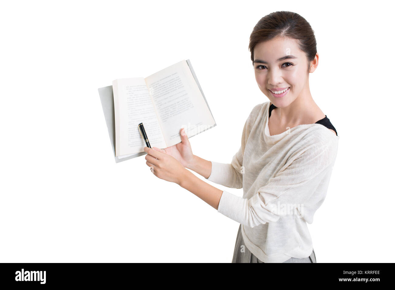 Young female Chinese teacher teaching with textbook Stock Photo - Alamy