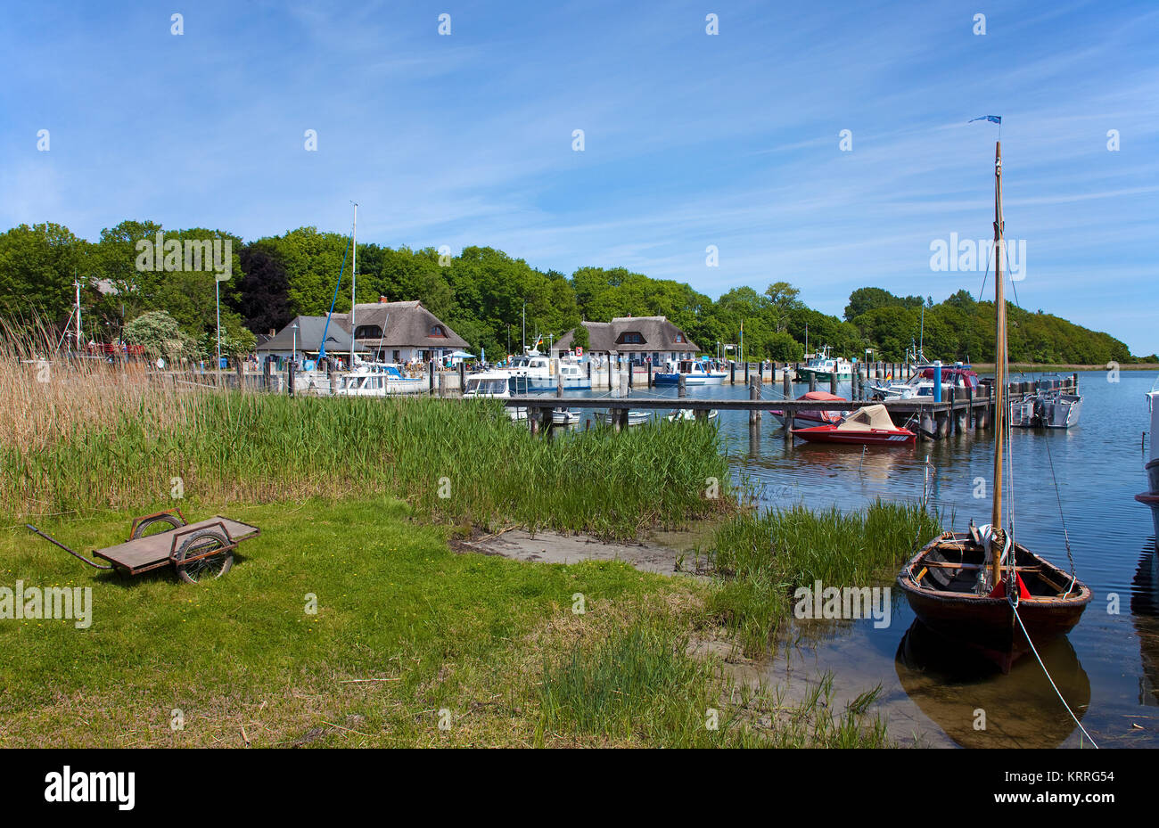 Motor boats and sailing boats at the harbour of the village Kloster ...