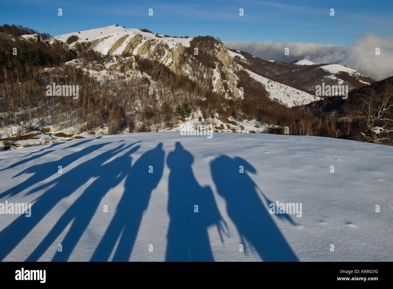 People shadows on the snow in the mountains Stock Photo - Alamy