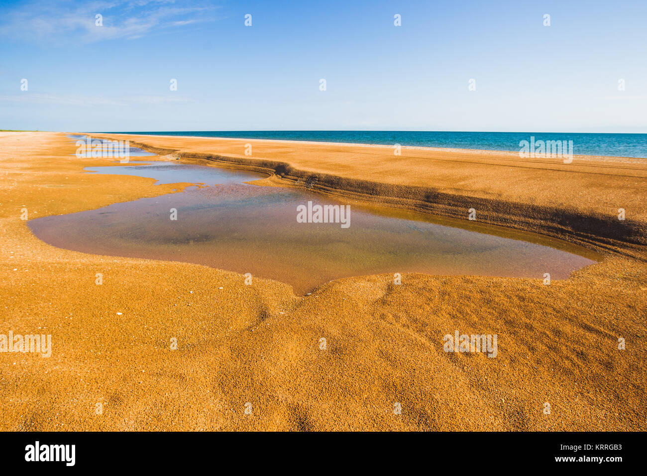 Sea coast with clean empty sand beach Stock Photo - Alamy