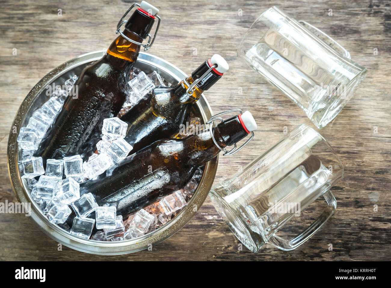 Bottles of beer in ice cubes Stock Photo - Alamy