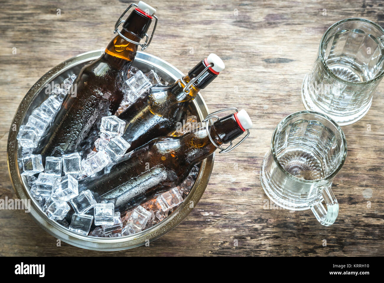 Bottles of beer in ice cubes Stock Photo - Alamy