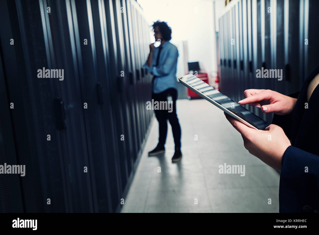 Working on tablet. server room Stock Photo - Alamy