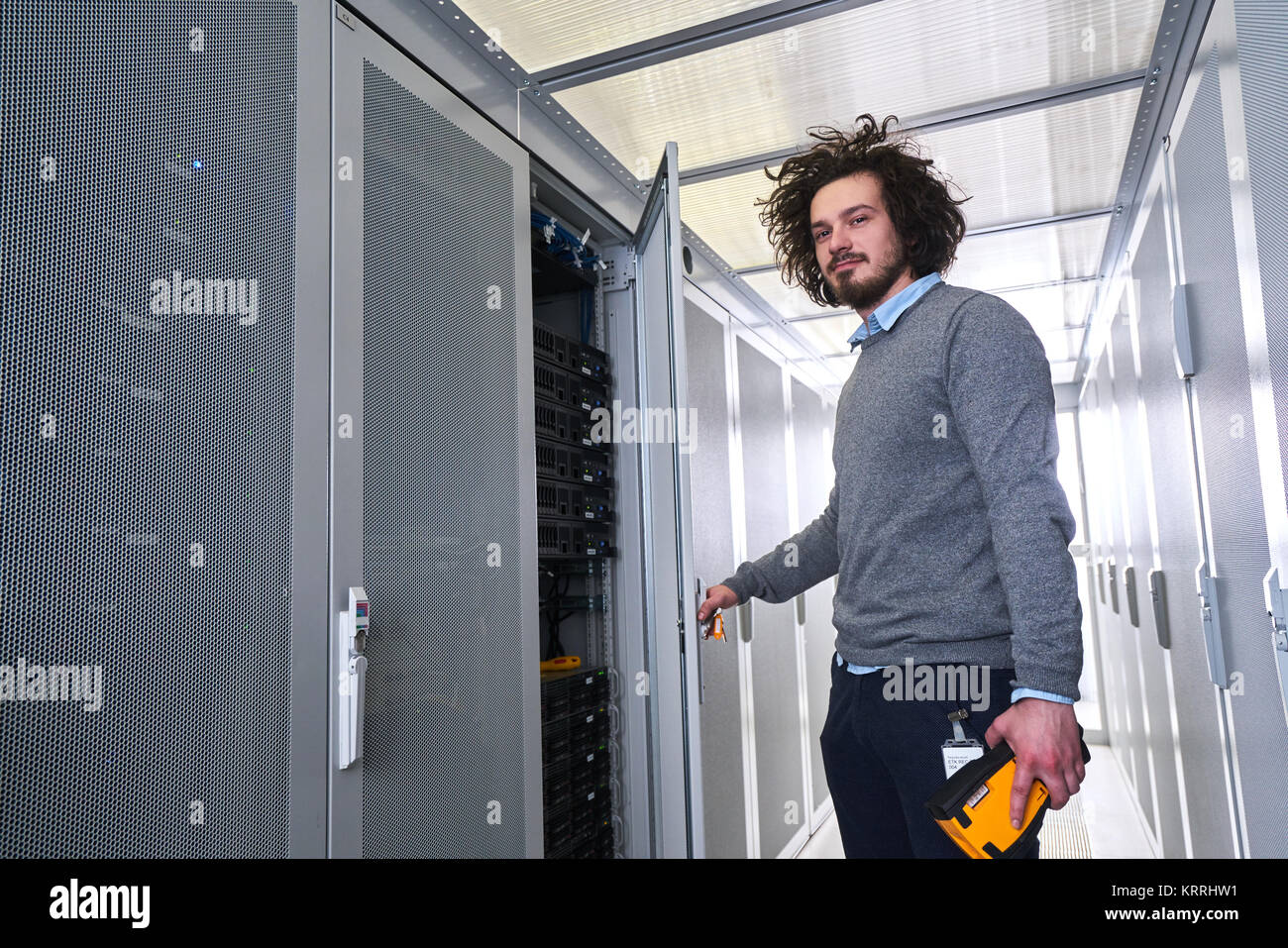 Young technician working Stock Photo - Alamy