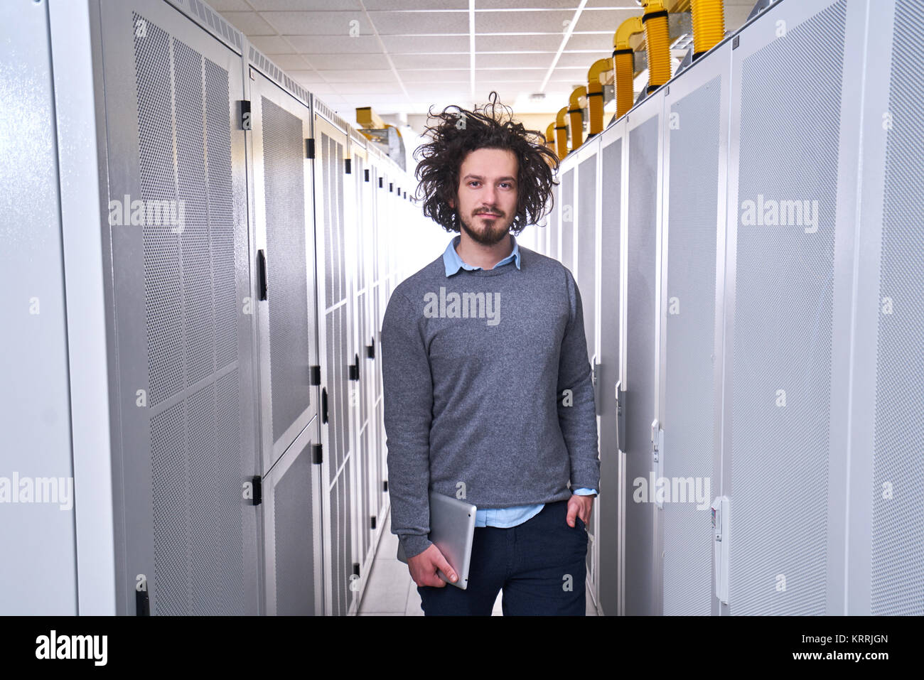 Young technician working in white server room Stock Photo - Alamy