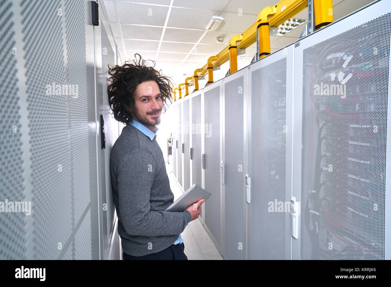 Young technician working in white server room Stock Photo - Alamy