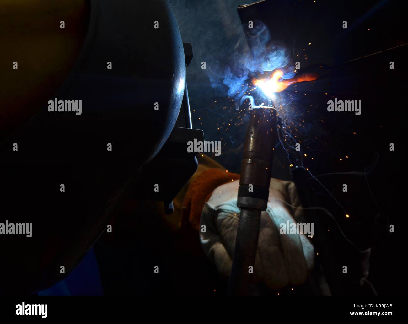 A man welding a project Stock Photo - Alamy