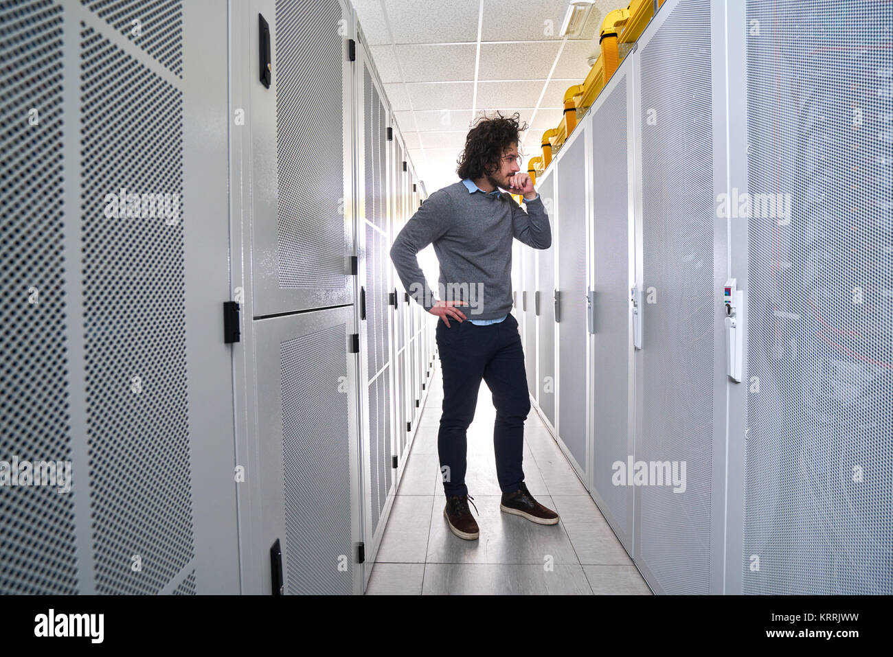 Young technician working in white server room Stock Photo - Alamy