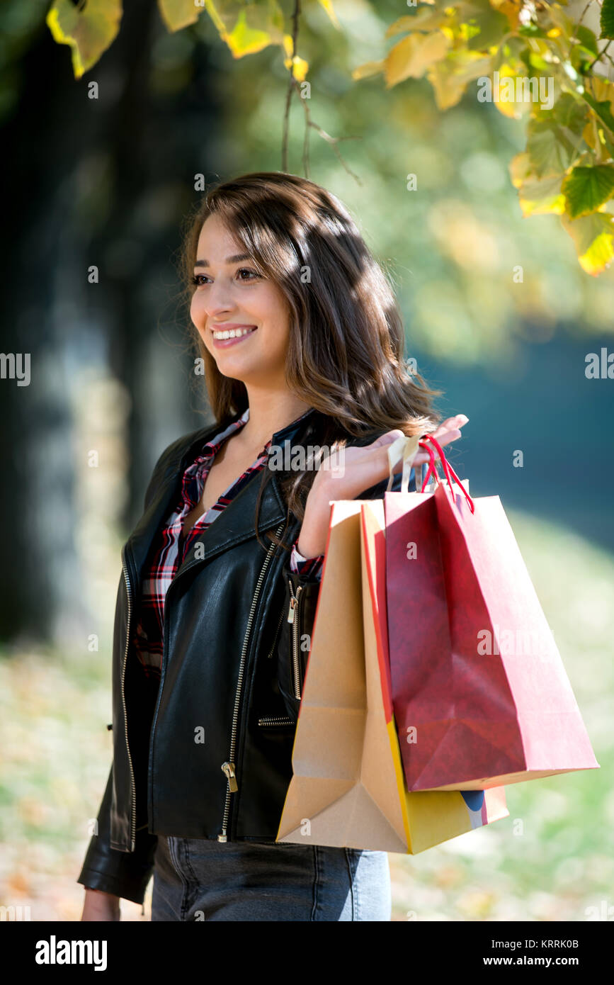 Happy girls shopping in late autumn. bags, walking, holidays Stock ...
