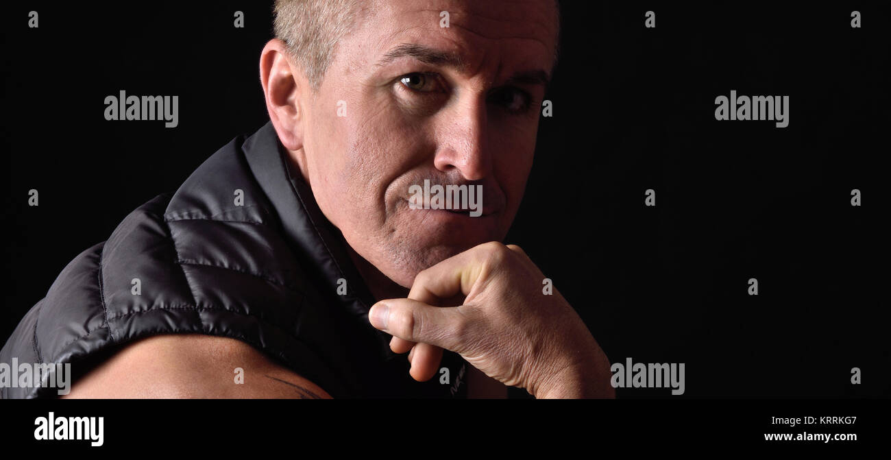 portrait of a man on black background Stock Photo - Alamy