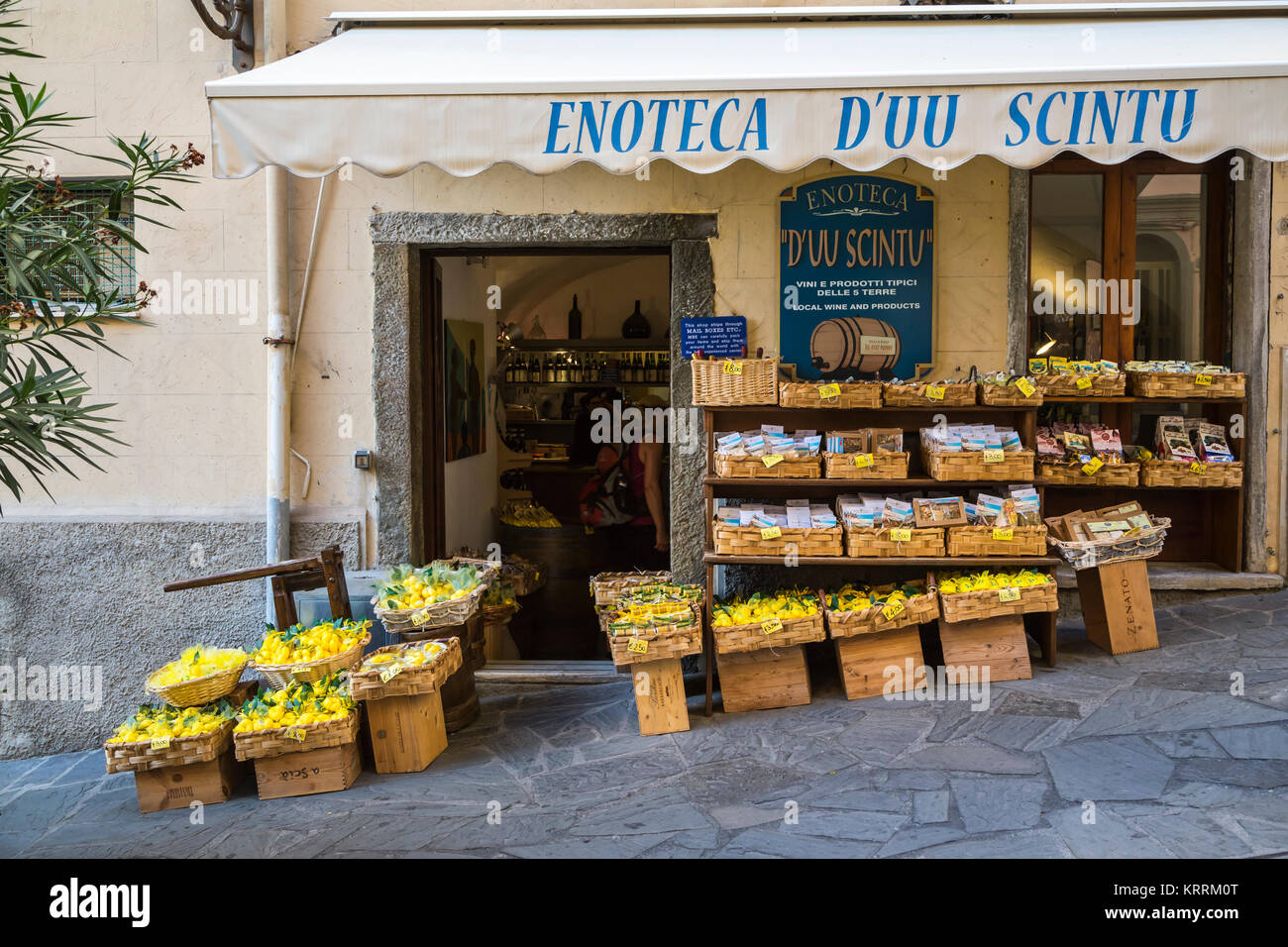 A storefront and street in the village of Riomaggiore, Cinque Terre ...