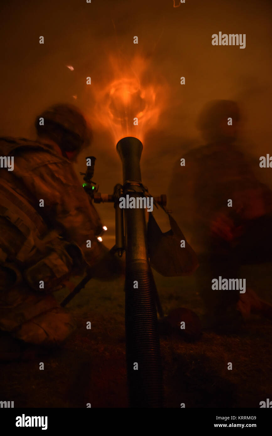 U.S. Army soldiers fire M252A1 mortar rockets during a night fire ...