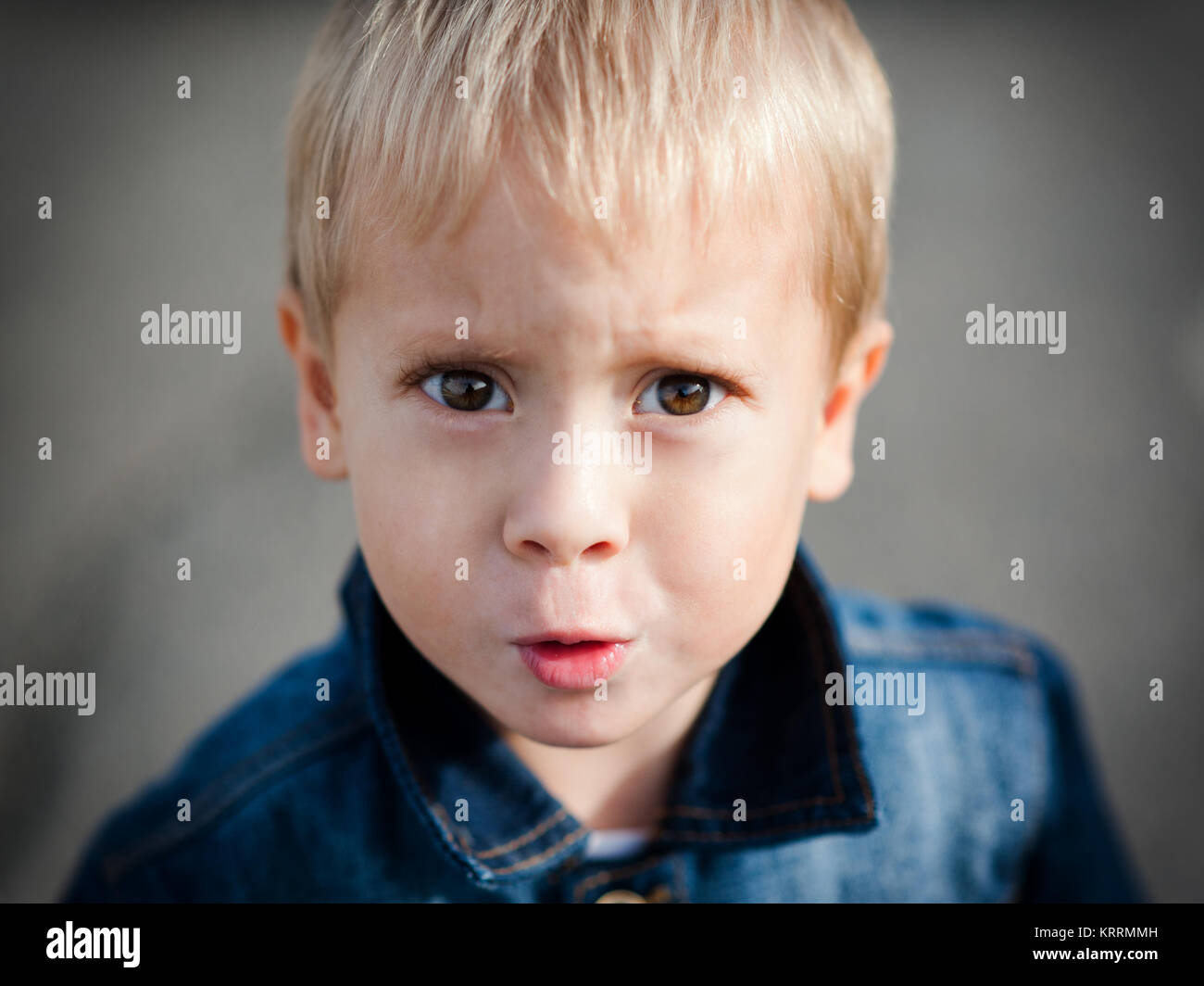 Portrait of the offended little boy Stock Photo - Alamy