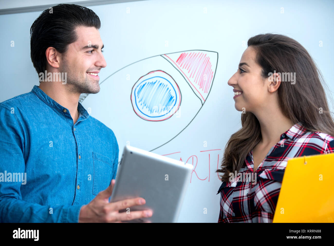 Young people comparing ideas at startup meeting board. concept Stock ...
