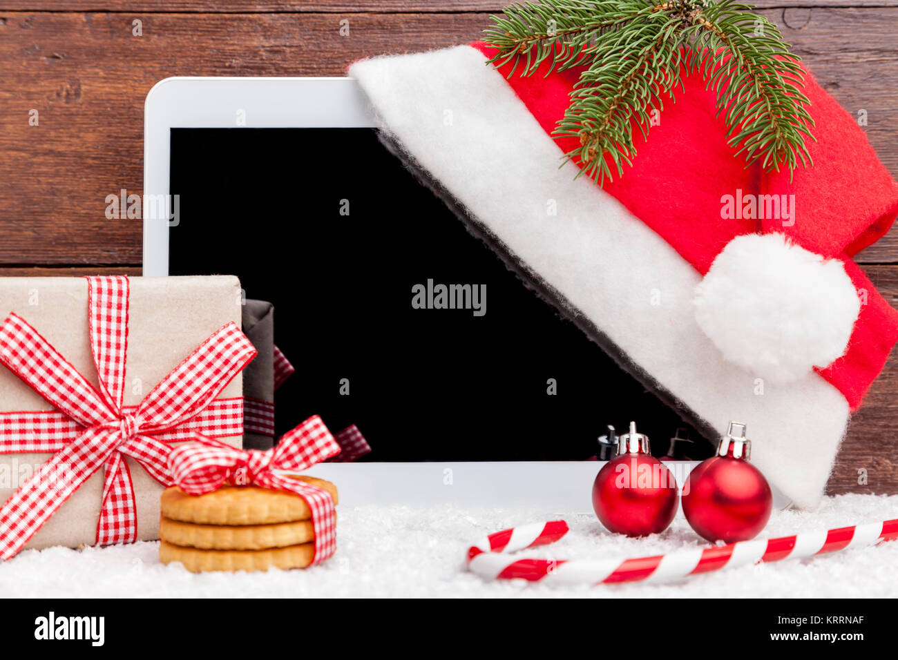 Christmas decoration and a tablet with copy space Stock Photo - Alamy