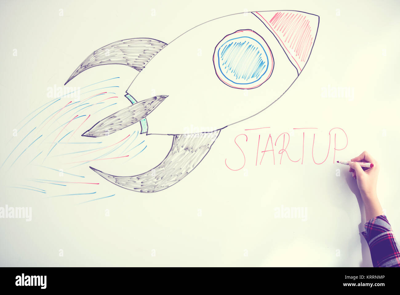 Startup rocket on whiteboard, concept Stock Photo - Alamy