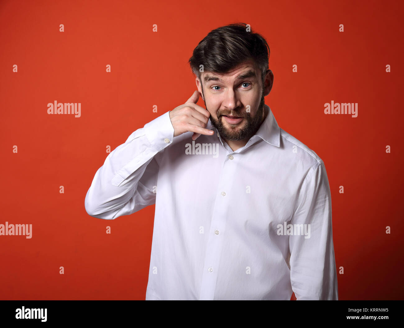 Excited funny surprising business man showing call me gesture with ...