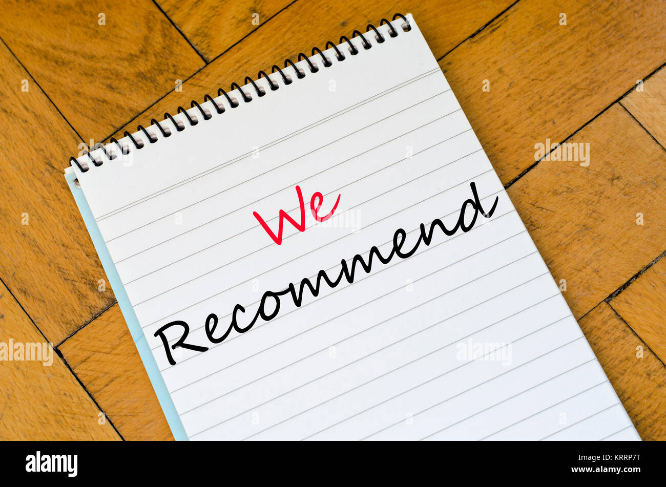 We recommend concept on notebook Stock Photo - Alamy