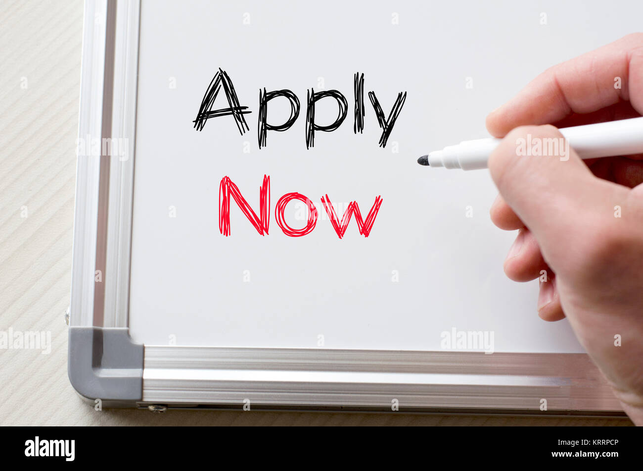 Apply now written on whiteboard Stock Photo - Alamy