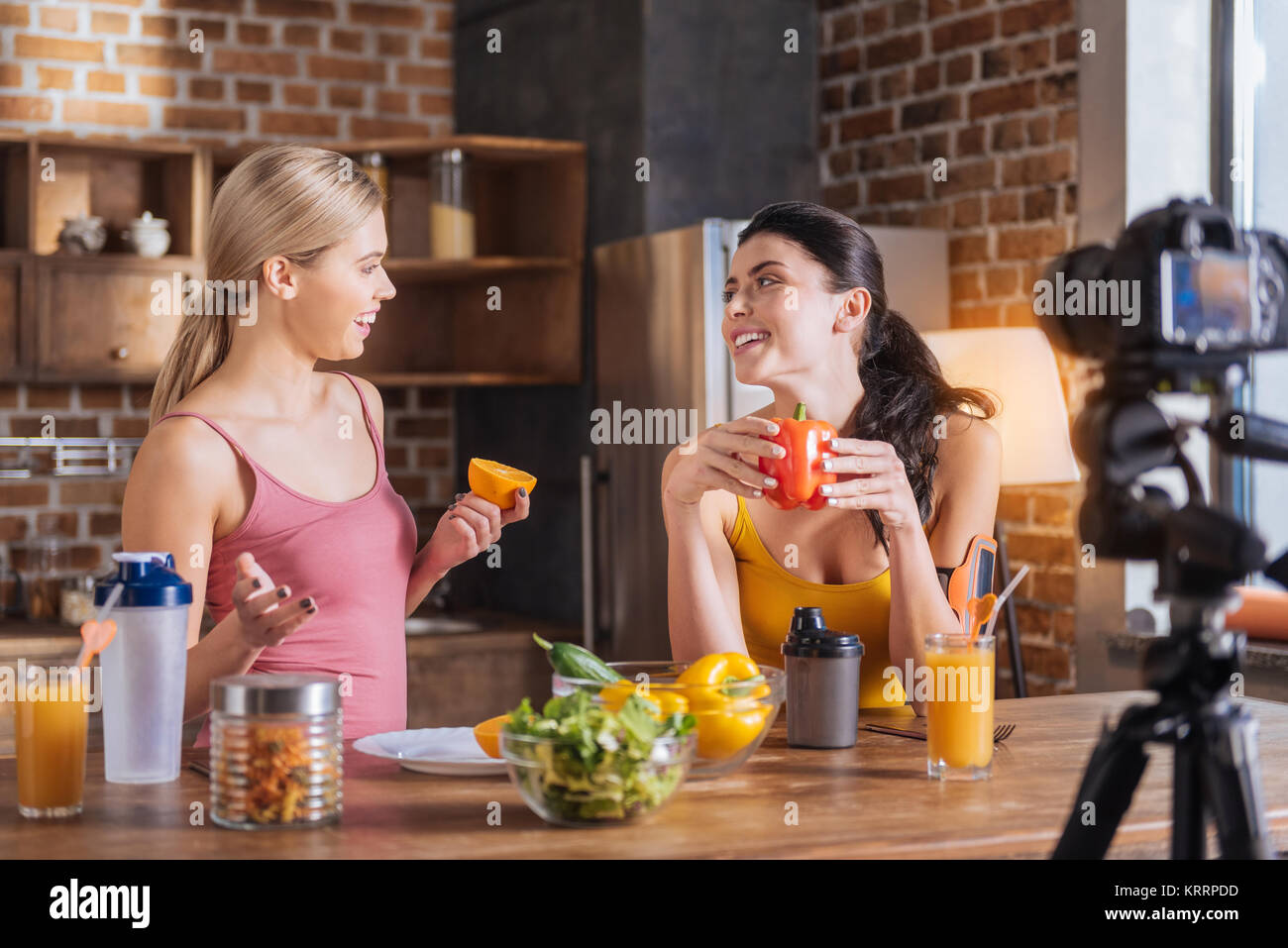 Positive joyful women talking to each other Stock Photo - Alamy
