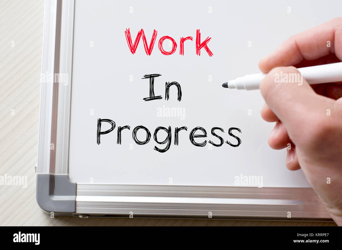 Work in progress written on whiteboard Stock Photo - Alamy