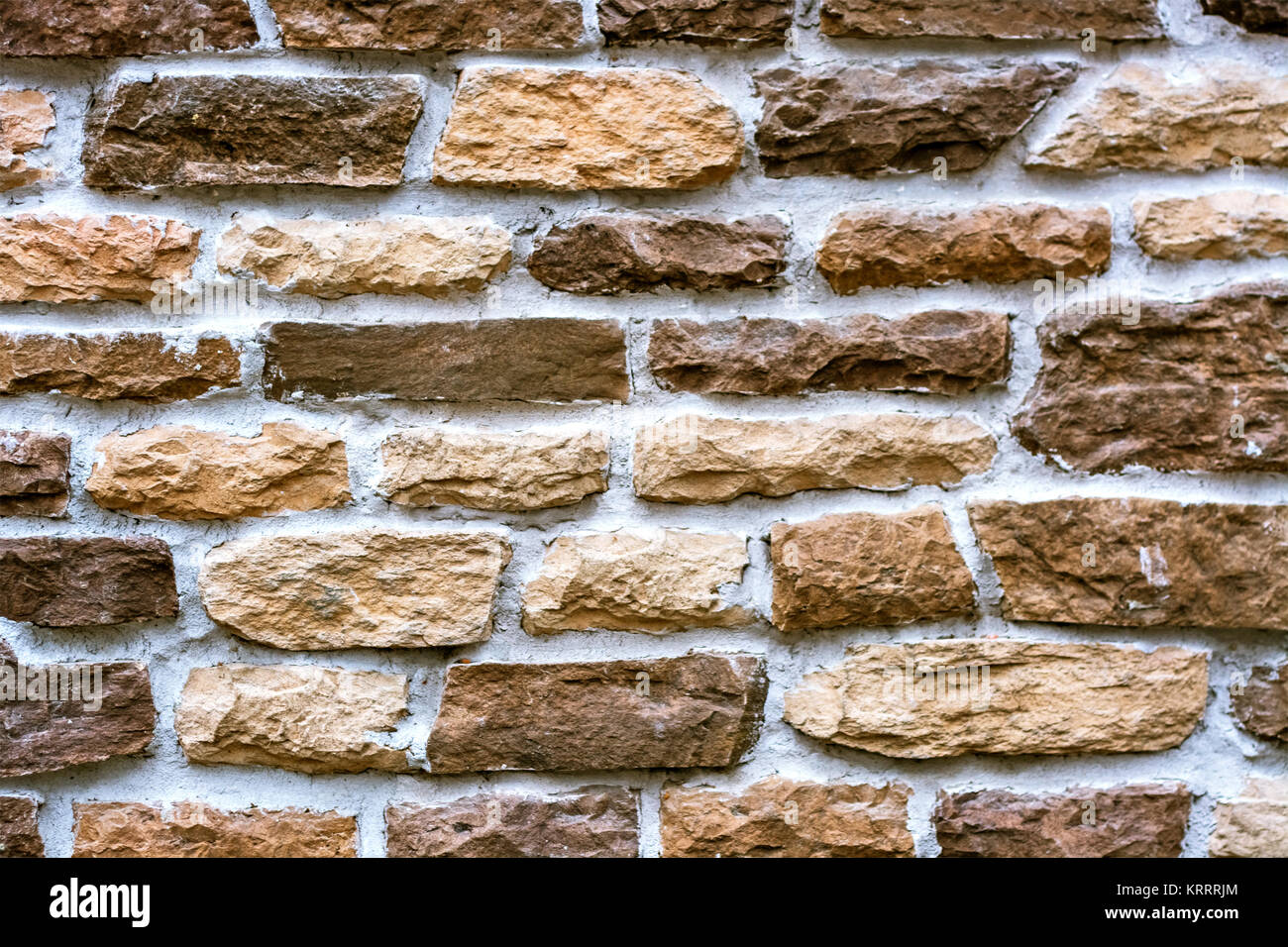 Part of the wall lined with a ginger stone for use as a background ...