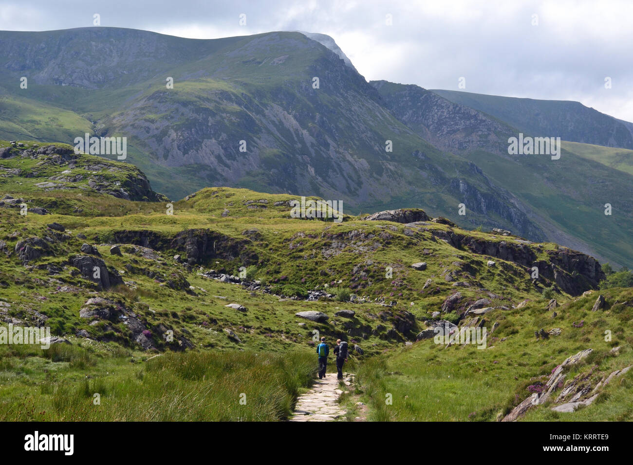 Two walkers returning from Mount Tryfan on route towards Llyn Ogwen ...