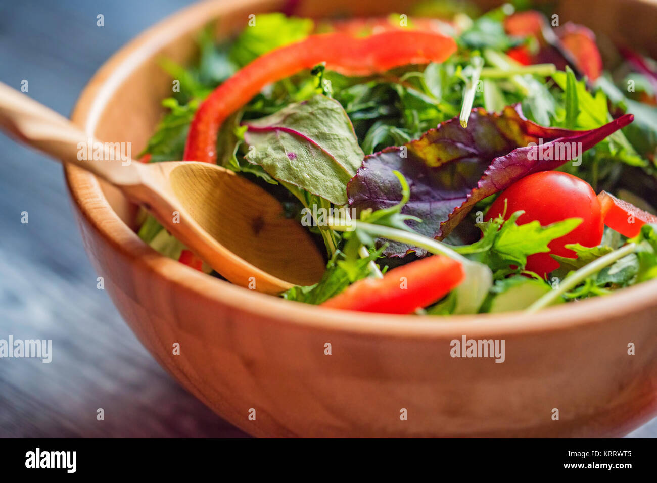 Fresh rustic vegetable salad on rustic background Stock Photo - Alamy