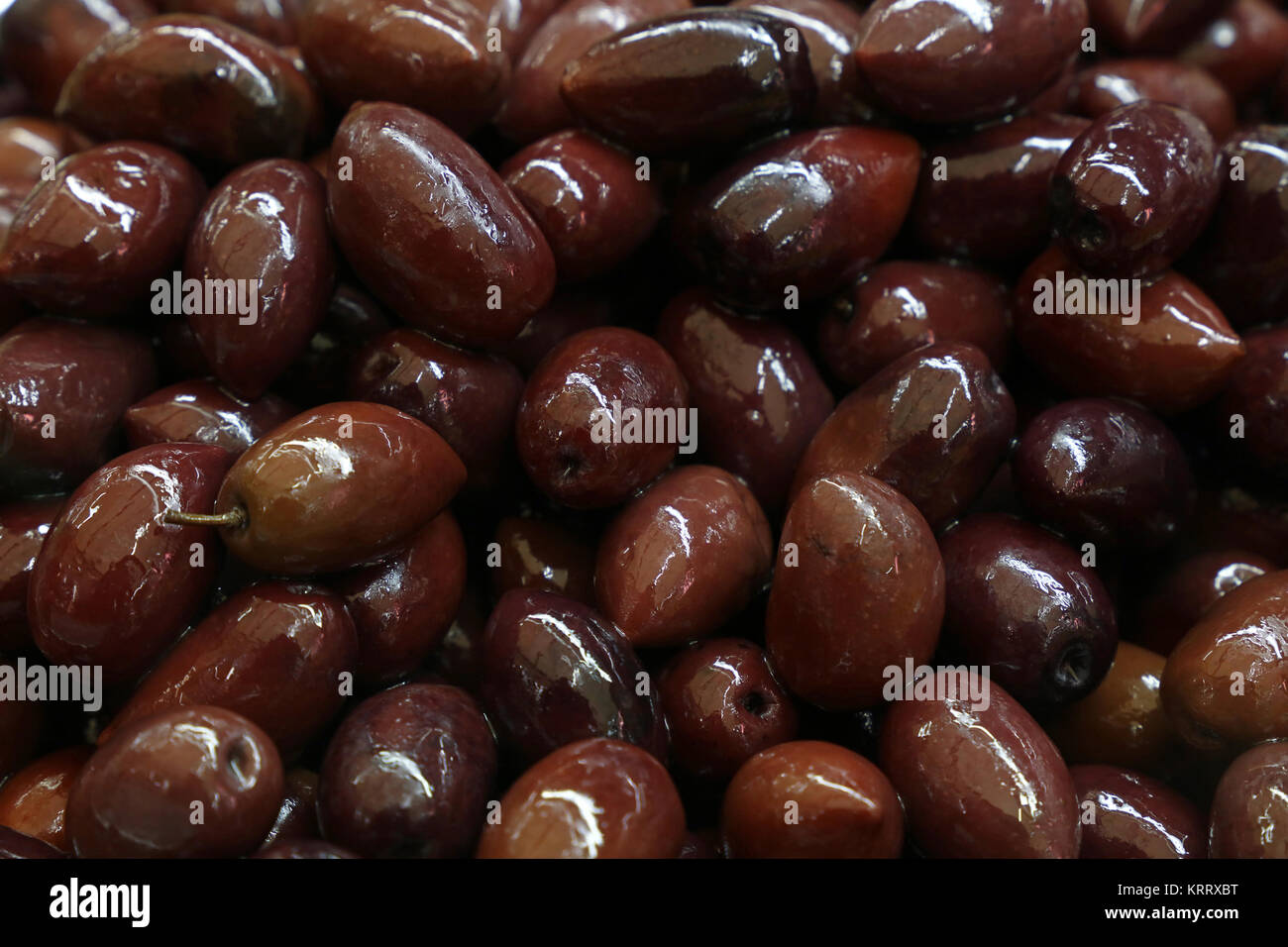 Greek Kalamata whole black glossy olives Stock Photo - Alamy