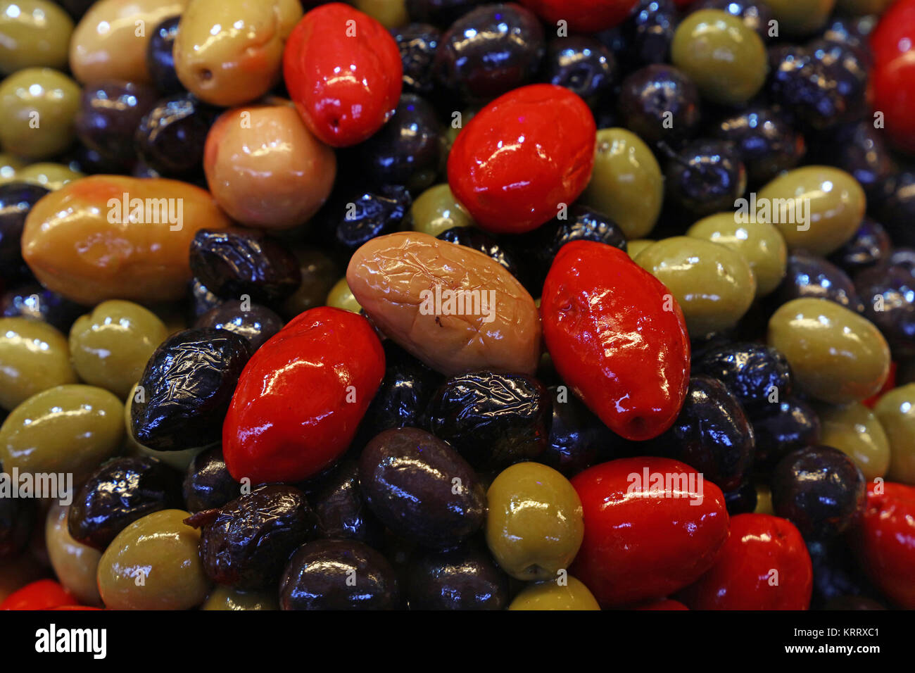 Mix of olives in oil close up Stock Photo - Alamy