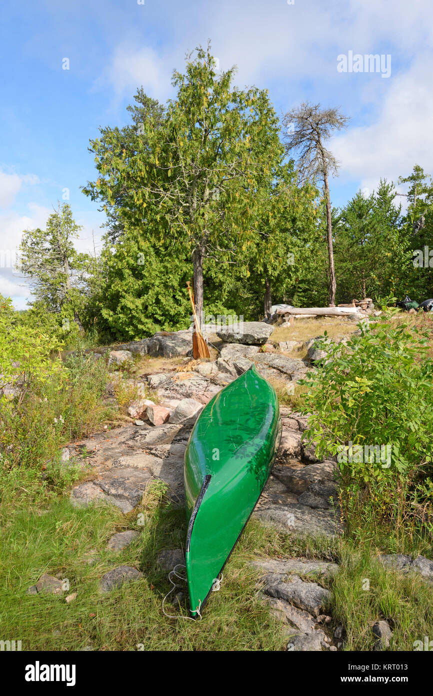 Canoe in Camp in the Shore Stock Photo - Alamy