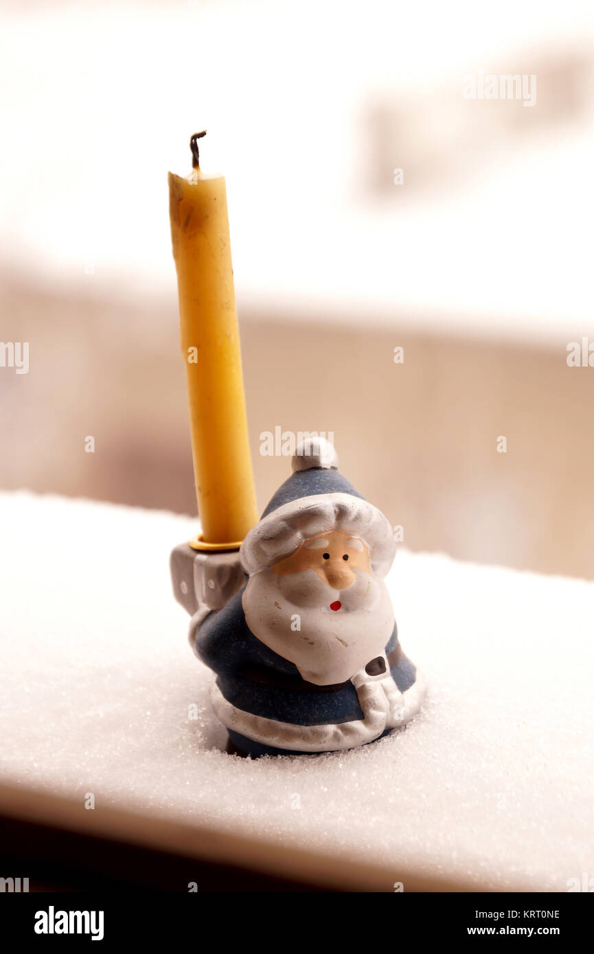 Support under a candle in the form of Father Frost Stock Photo - Alamy