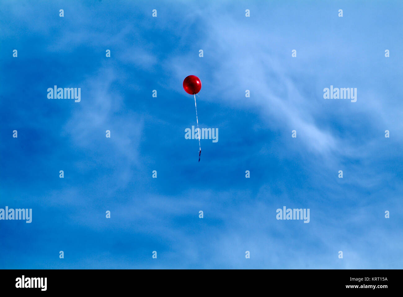 Solo Flight of a red Ballon Stock Photo - Alamy